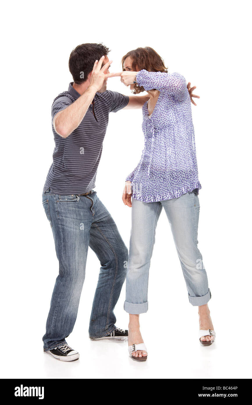 Angry couple yelling at each other over white background Stock Photo ...