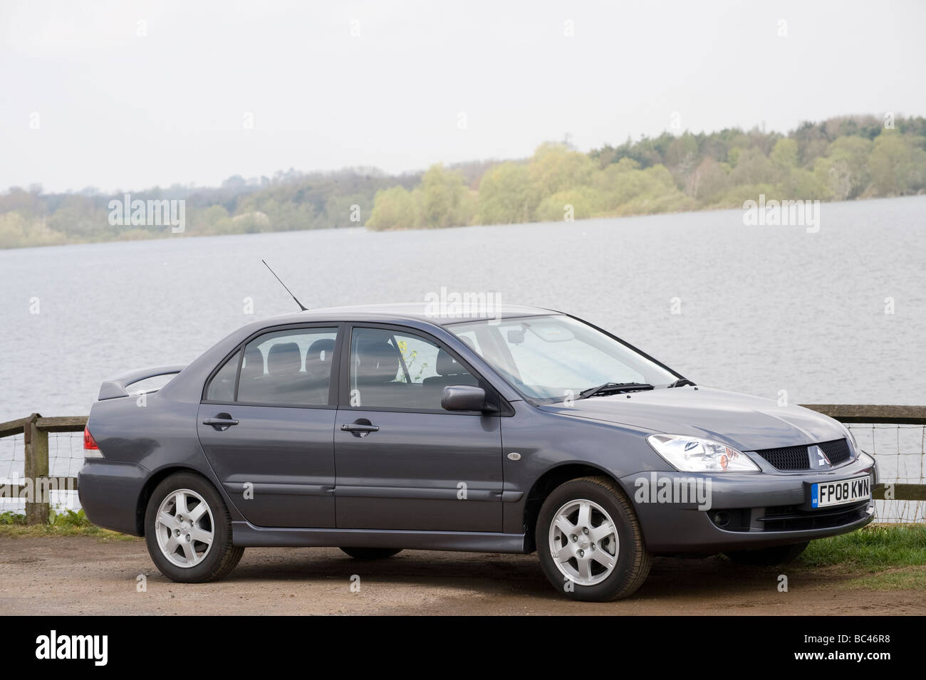 Side view of a 2008 Mitsubishi Lancer Equippe car parked at the side of ...