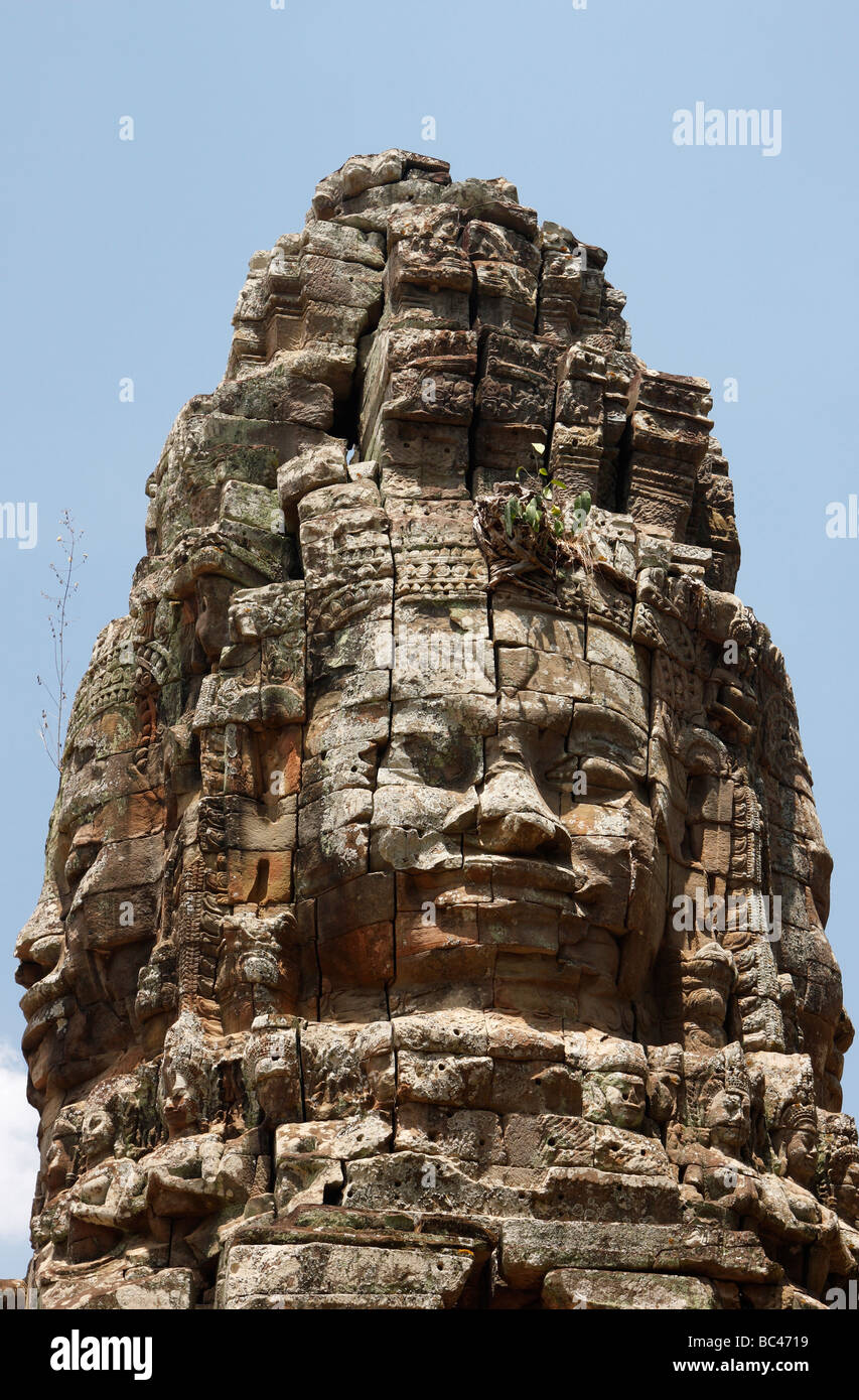 Buddha faces carved in stone tower, "Ta Prohm" temple ruins, Angkor ...