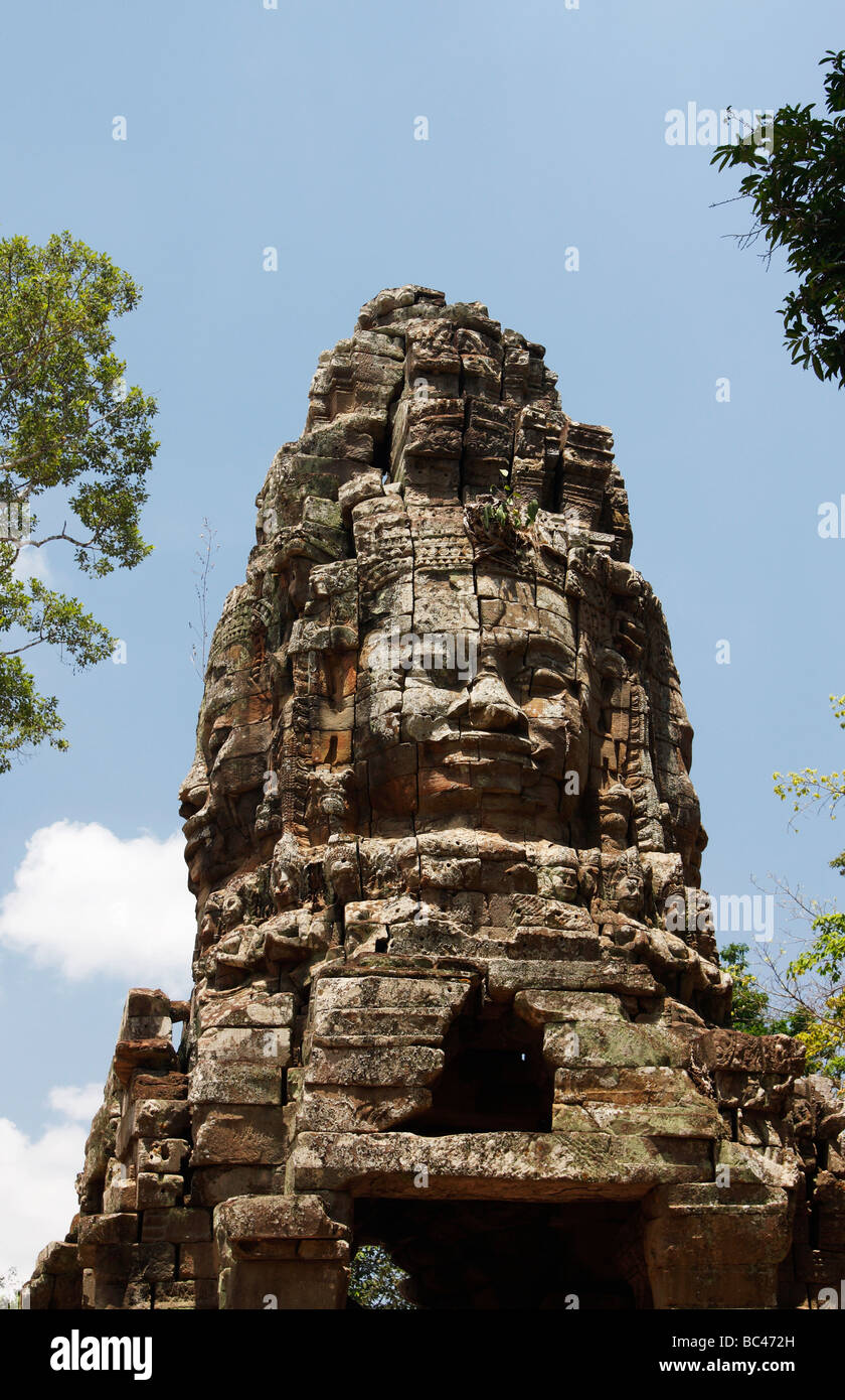 Huge stone Buddha faces carved above entrance tower to "Ta Prohm ...