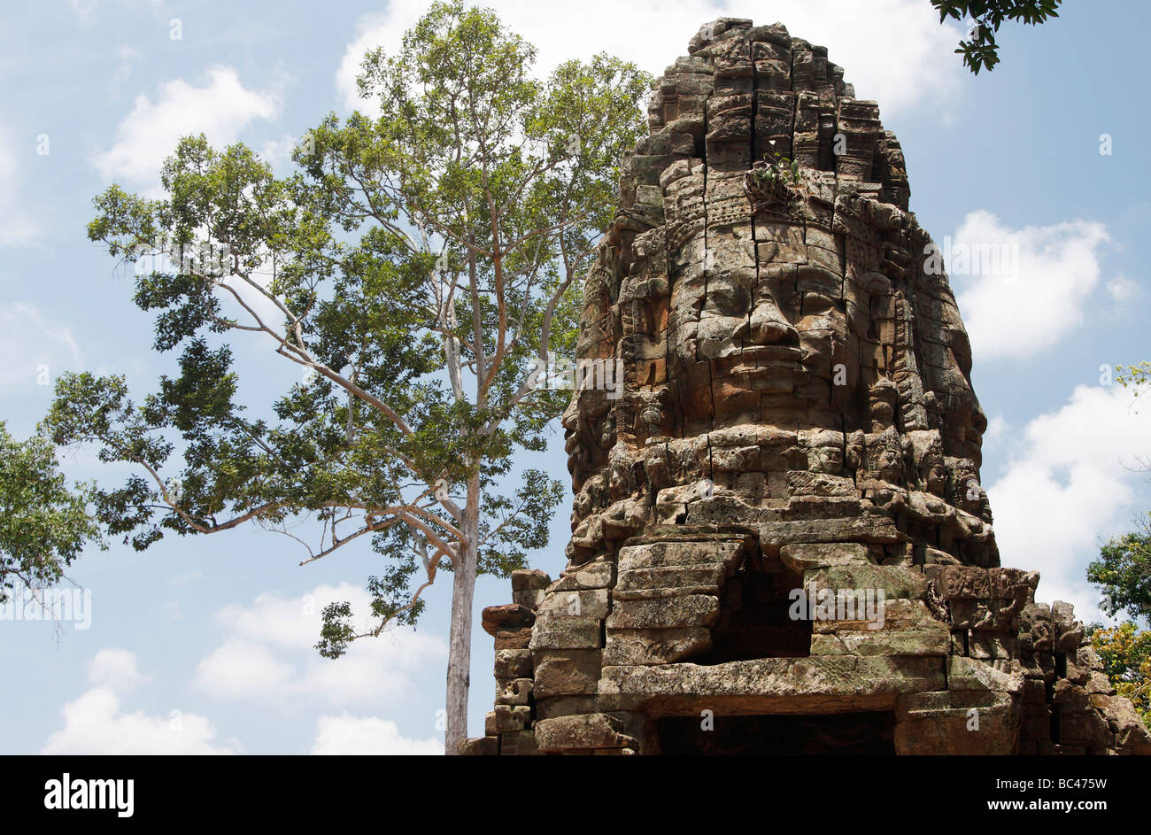 Huge stone Buddha faces carved above entrance tower to "Ta Prohm ...