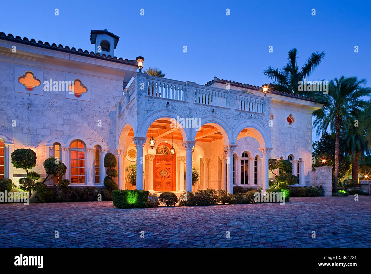 Night image of a portico chere at a luxury mansion in Boca Raton ...