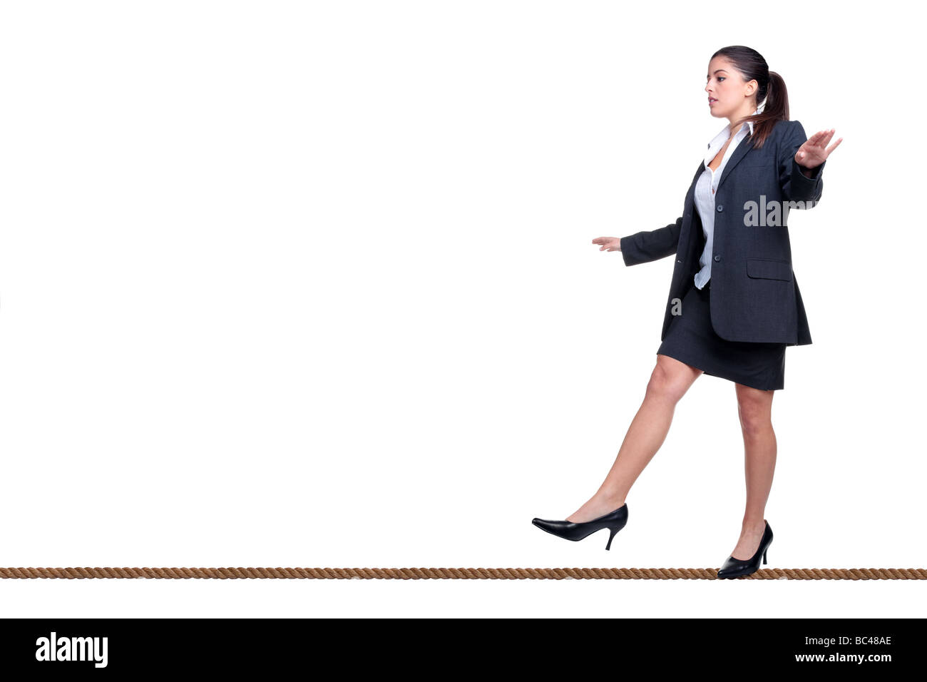 Office woman tightrope walking Cut Out Stock Images & Pictures - Alamy