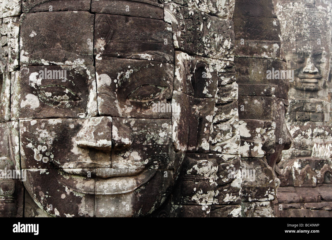 Large smiling face carved in stone, Bayon temple ruins, [Angkor Thom ...