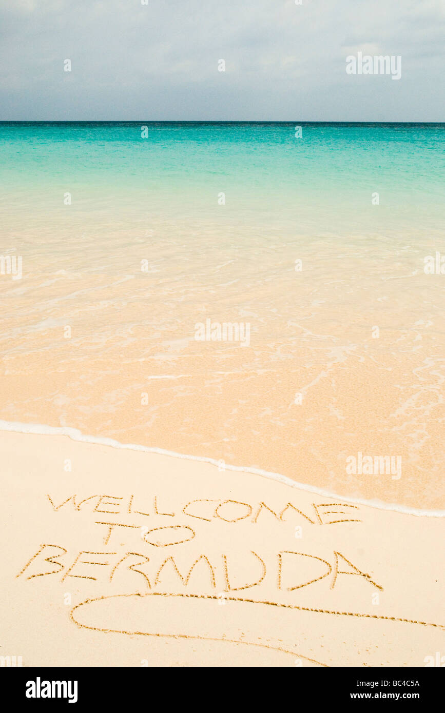 Pink sand beach scene with welcome to Bermuda written in the sand ...