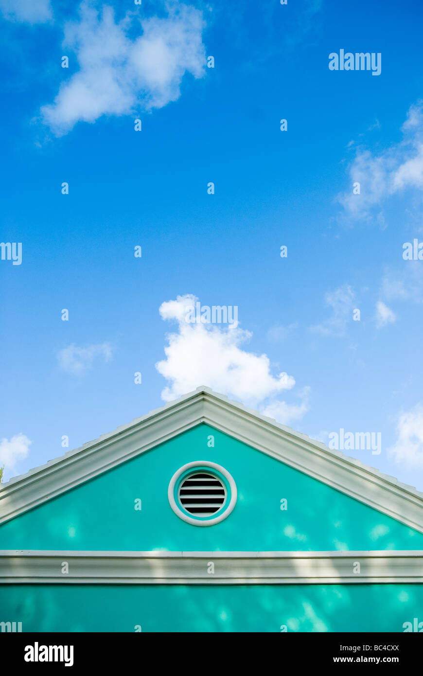 A colorful blue building rooftop in the shape of a triangle pointing to ...