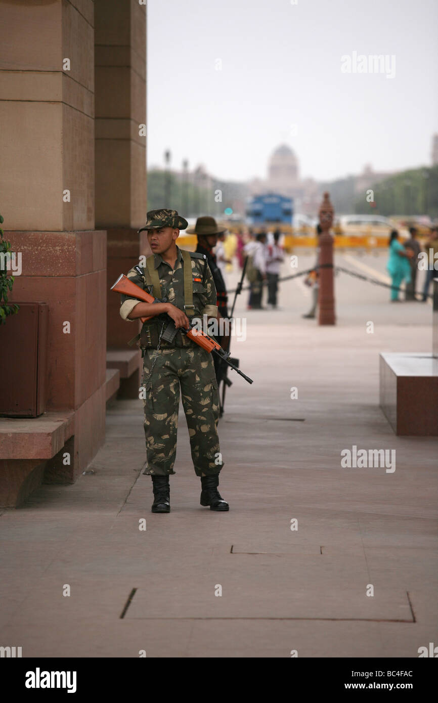 A soldier at India Gate the war memorial in New Delhi designed by Sir ...