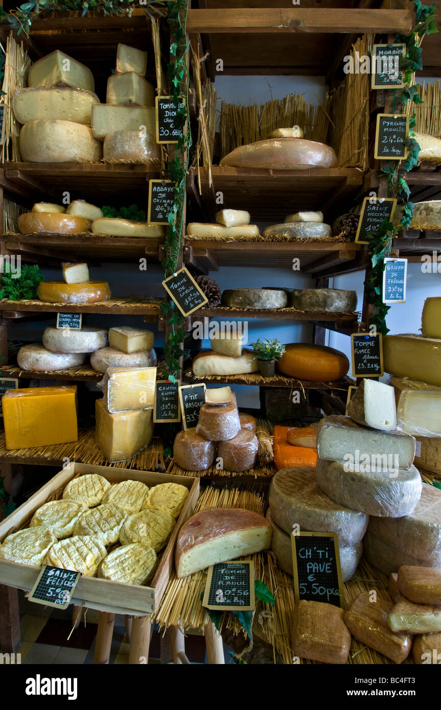 Selection of handmade cheeses on display in the artisan fromagerie ...