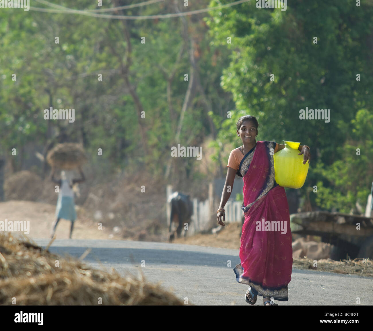 young girl carrying water rural India Stock Photo - Alamy