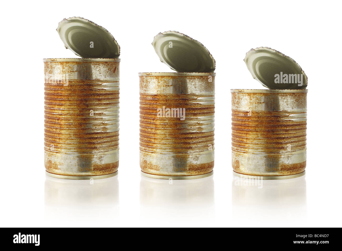 Rusty old tin cans arranged on white background Stock Photo - Alamy