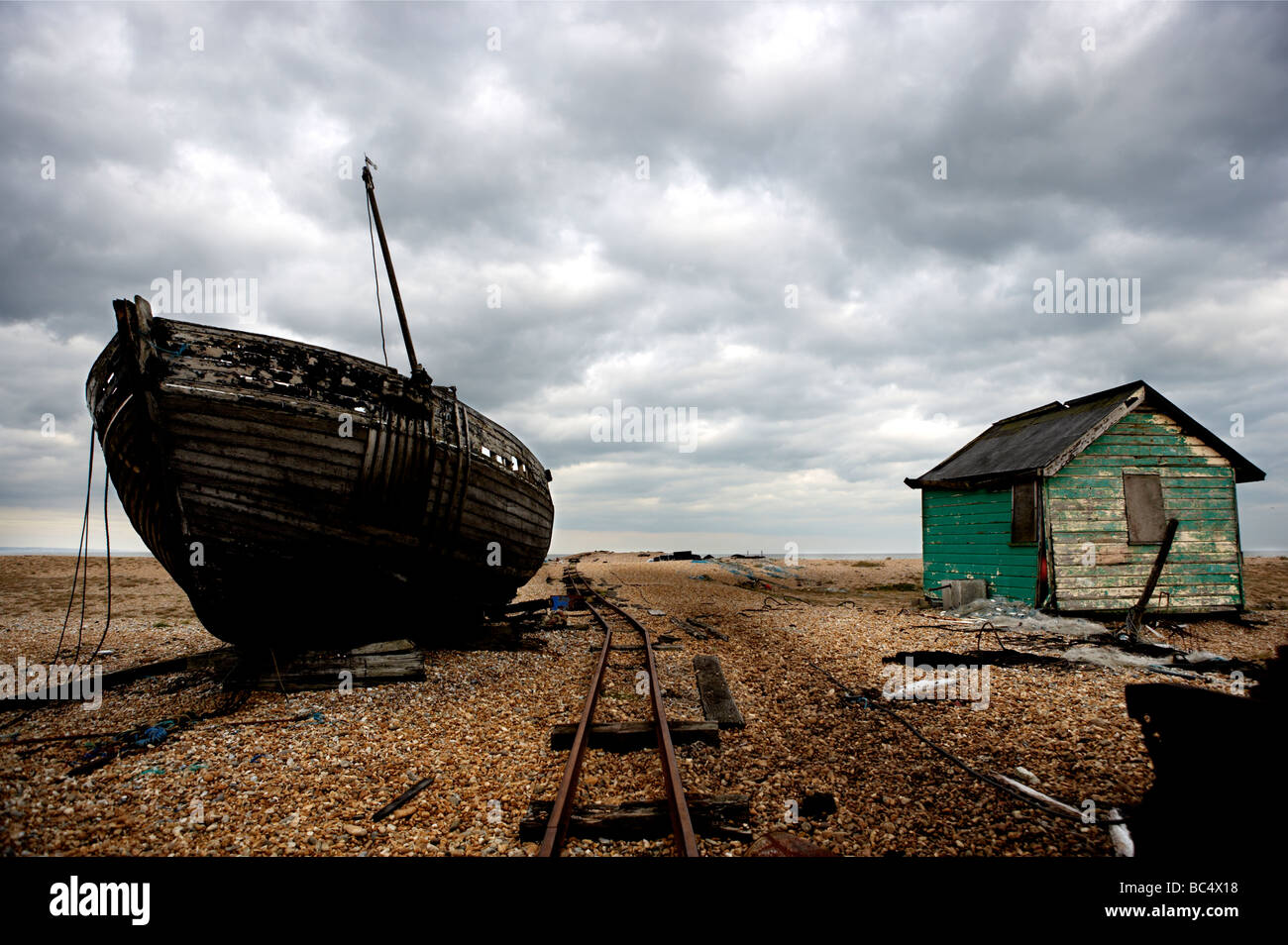 Trawler and shack on Dungeness beach Kent England Stock Photo - Alamy