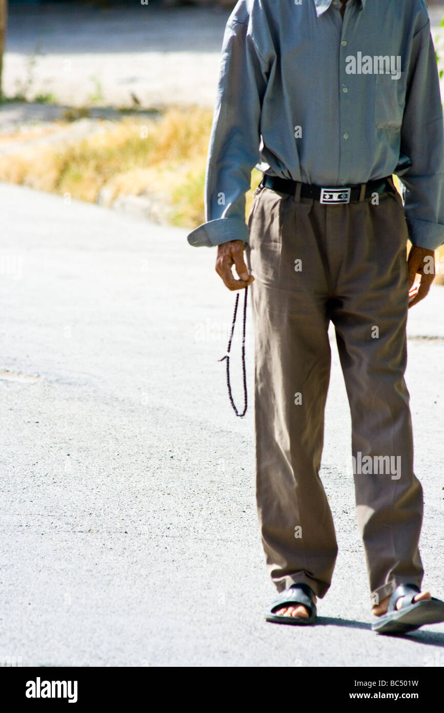 Muslim man walking hi-res stock photography and images - Alamy