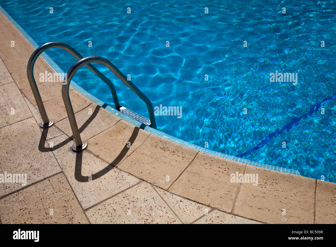 swimming pool blue water detail in summer time Stock Photo - Alamy