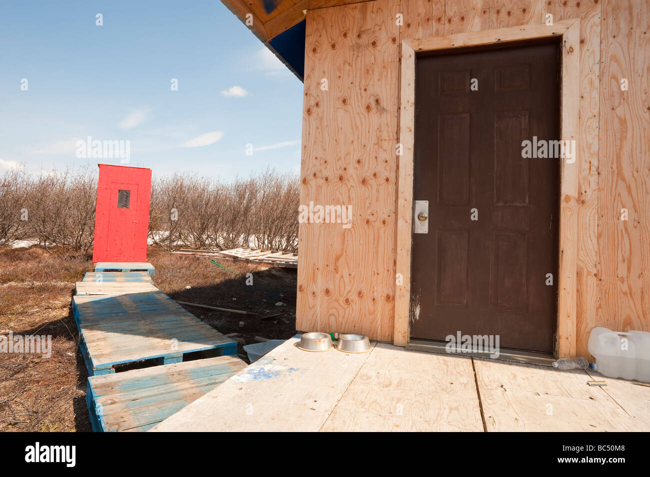 A CABIN WITH A RED OUTHOUSE ON THE ALASKAN TUNDRA Stock Photo - Alamy