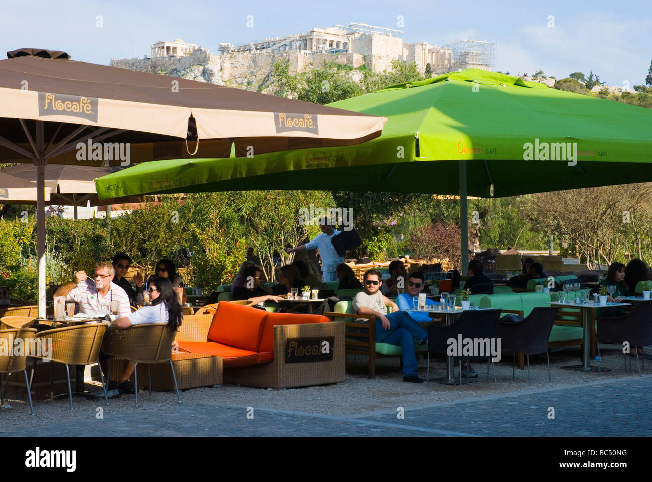 Cafe terrace with Acropolis in background in central Athens Greece ...