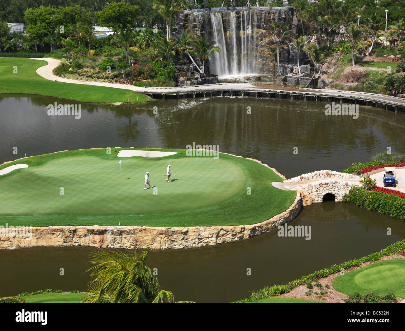 18th hole on golf course with golfer Stock Photo - Alamy