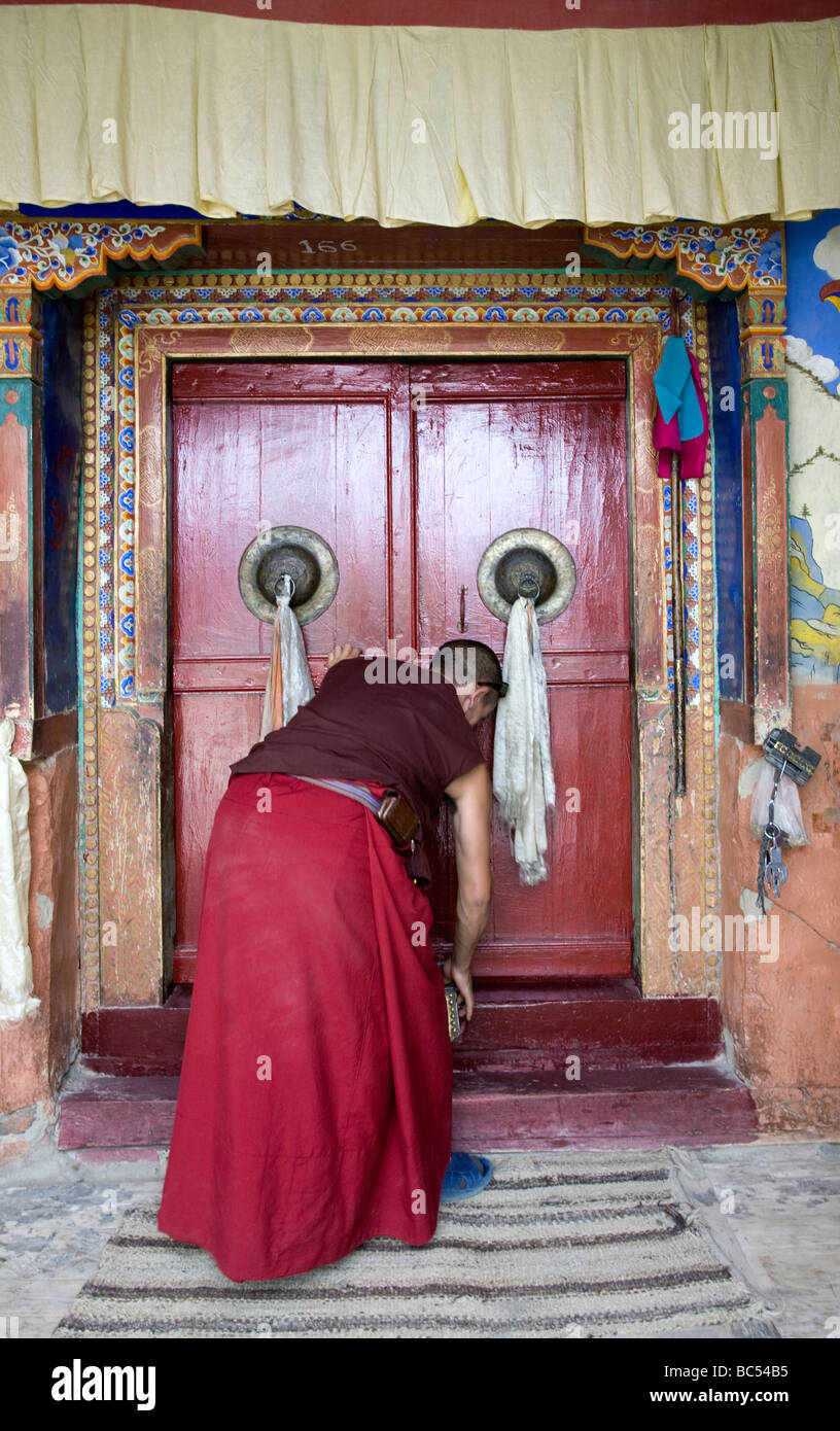Buddhist monk opening the Diskit gompa. Nubra Valley. Ladakh. India ...