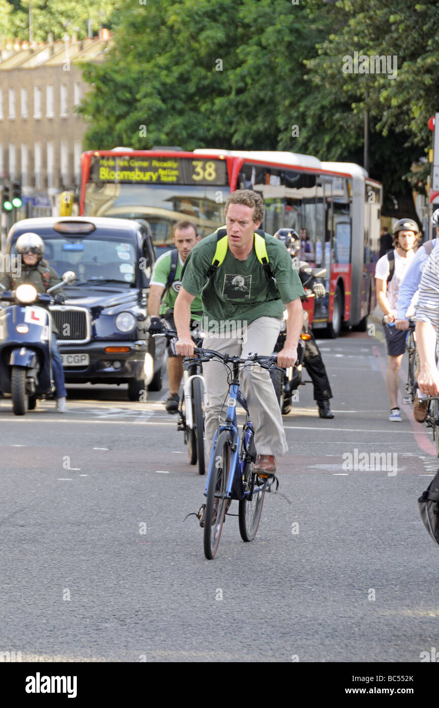 Cyclists in London rush hour traffic Angel Islington England UK Stock ...
