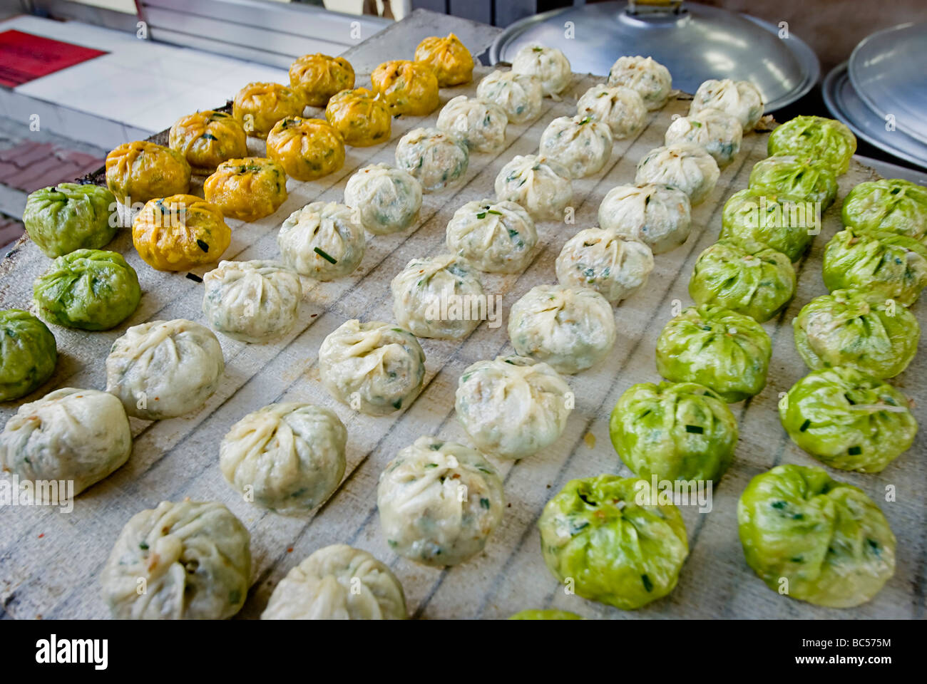 A display of mandu (mandoo) is colorfully arrayed for sale in a Korean ...