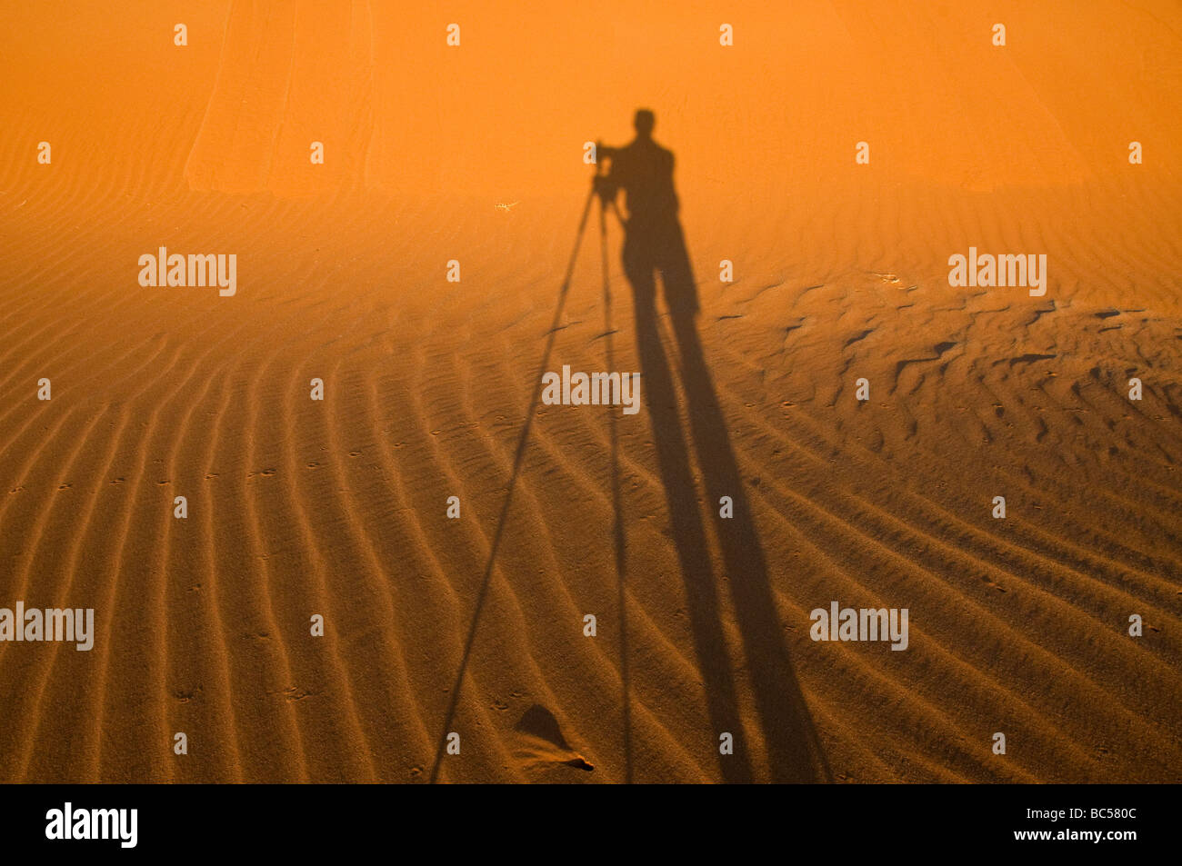 photographer's shadow on the beautiful sand dune landscape of ...
