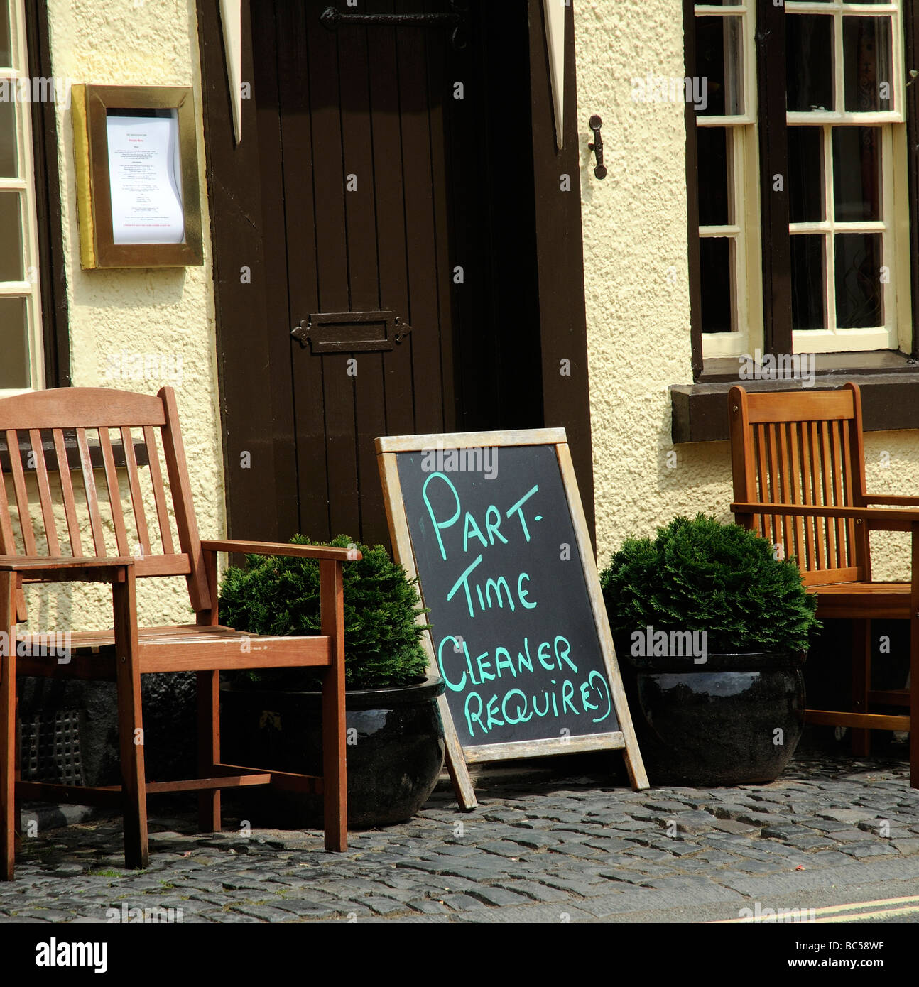 Part time cleaner required notice standing in pub doorway England UK ...