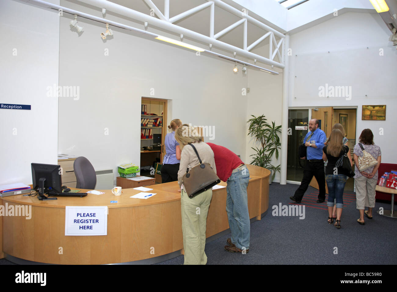 Modern business reception area Stock Photo - Alamy