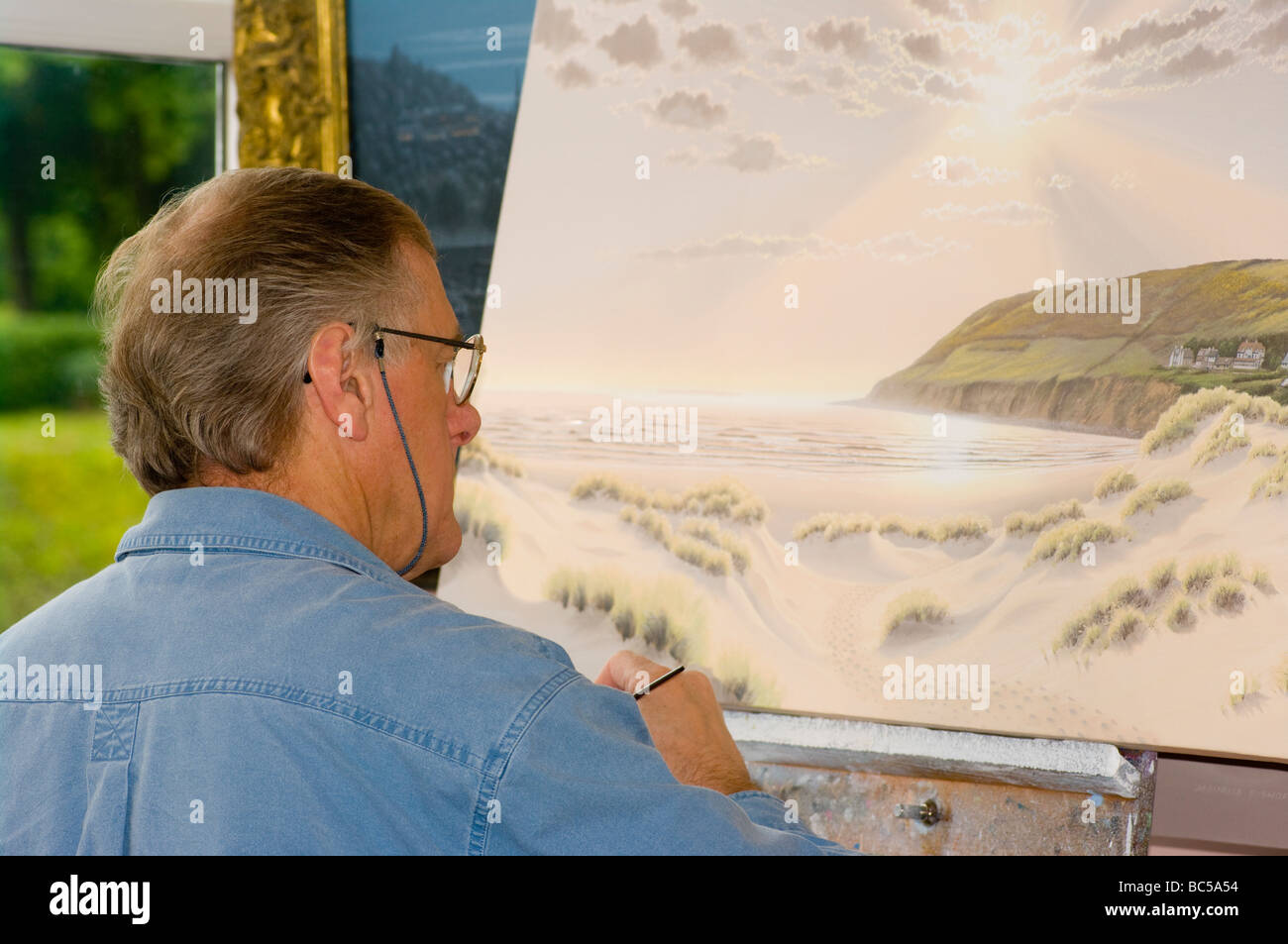 Artist Painting A Scene In His Studio Stock Photo - Alamy