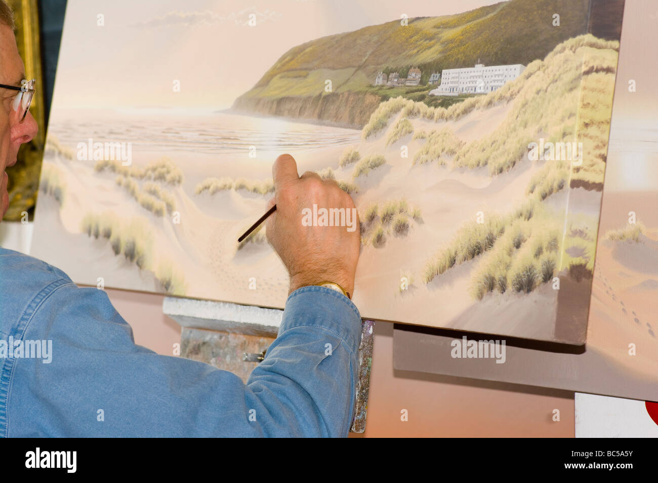 Artist Painting A Scene In His Studio Stock Photo - Alamy