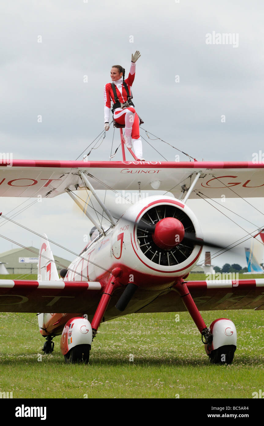 Team Guinot Barnstorming biplane taxies out with young woman strapped ...