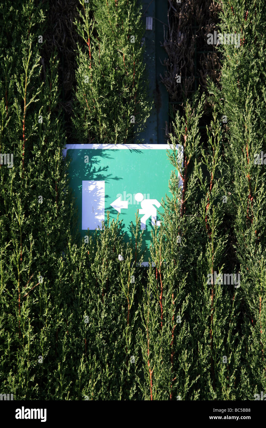 one emergency exit route sign notice outdoors Stock Photo - Alamy