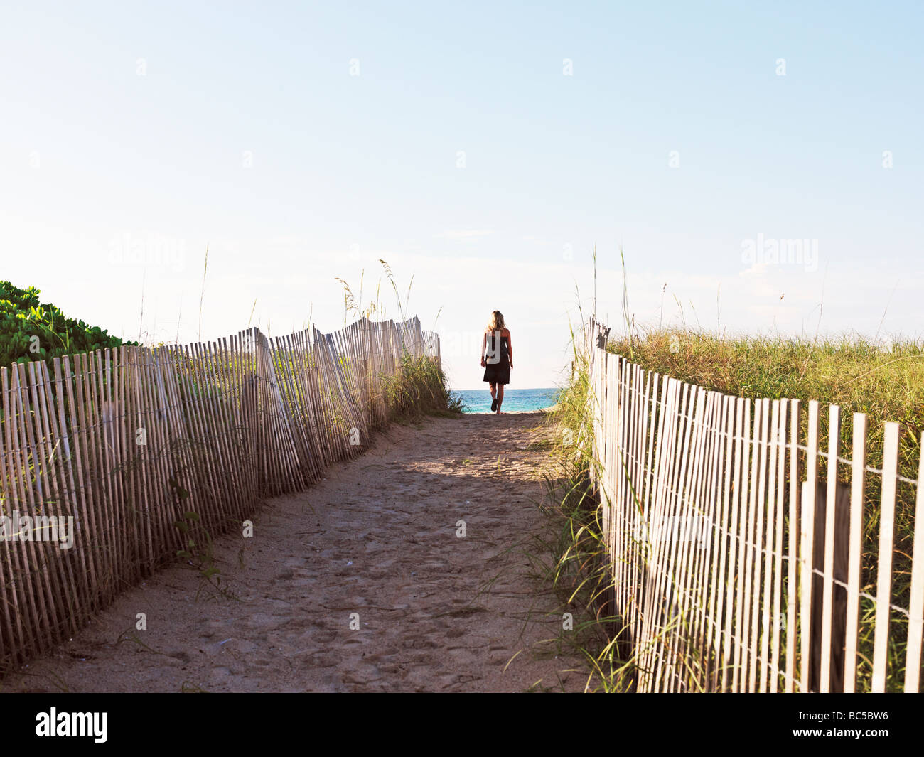 South Beach Miami,sandy path leading to beach with woman Stock Photo ...