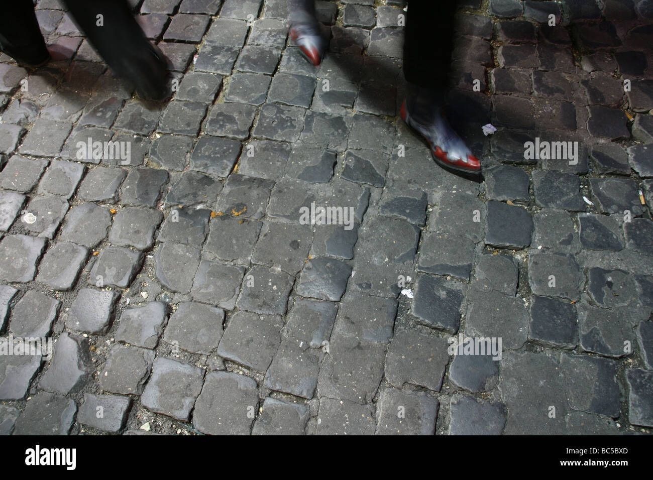 young people walking on city street pavement at night Stock Photo - Alamy