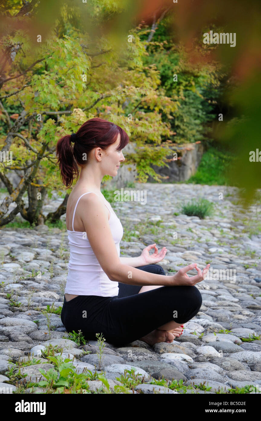 Germany, Bavaria, Munich, Young woman exercising yoga Stock Photo - Alamy
