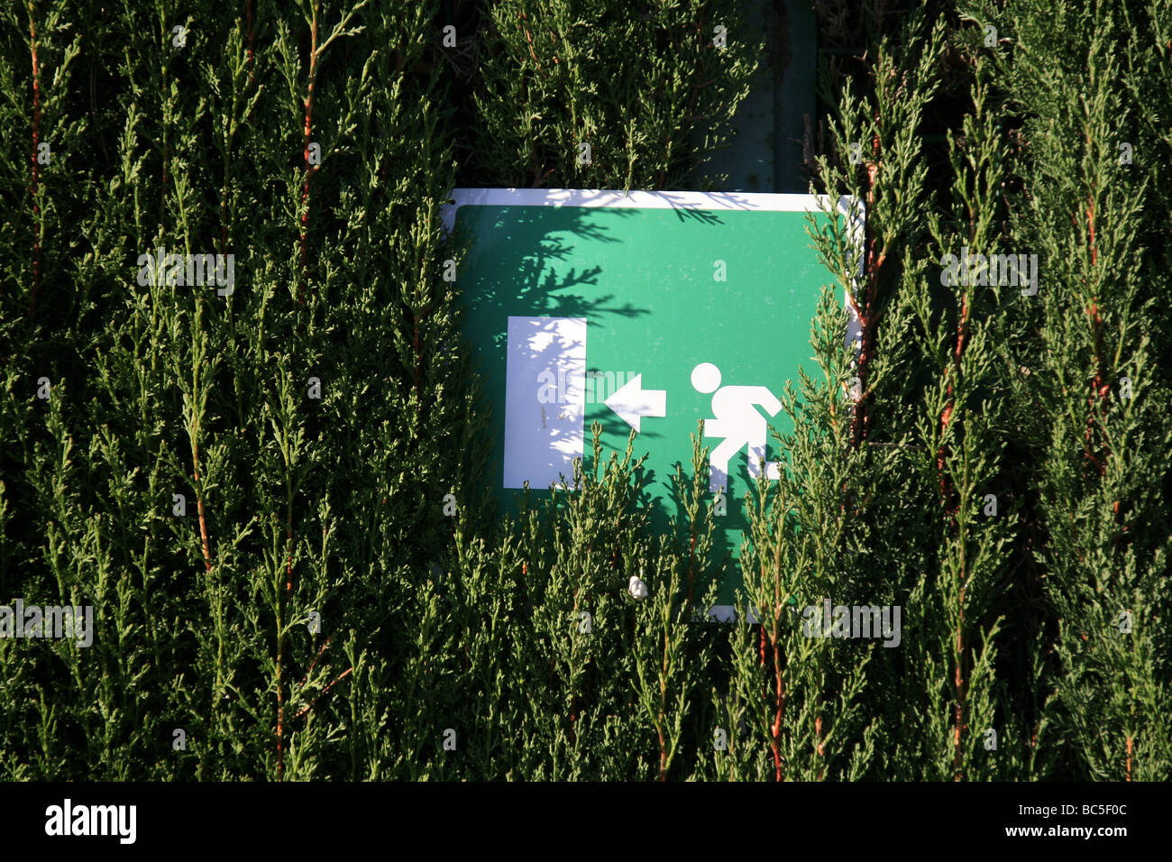 one emergency exit route sign notice outdoors Stock Photo - Alamy