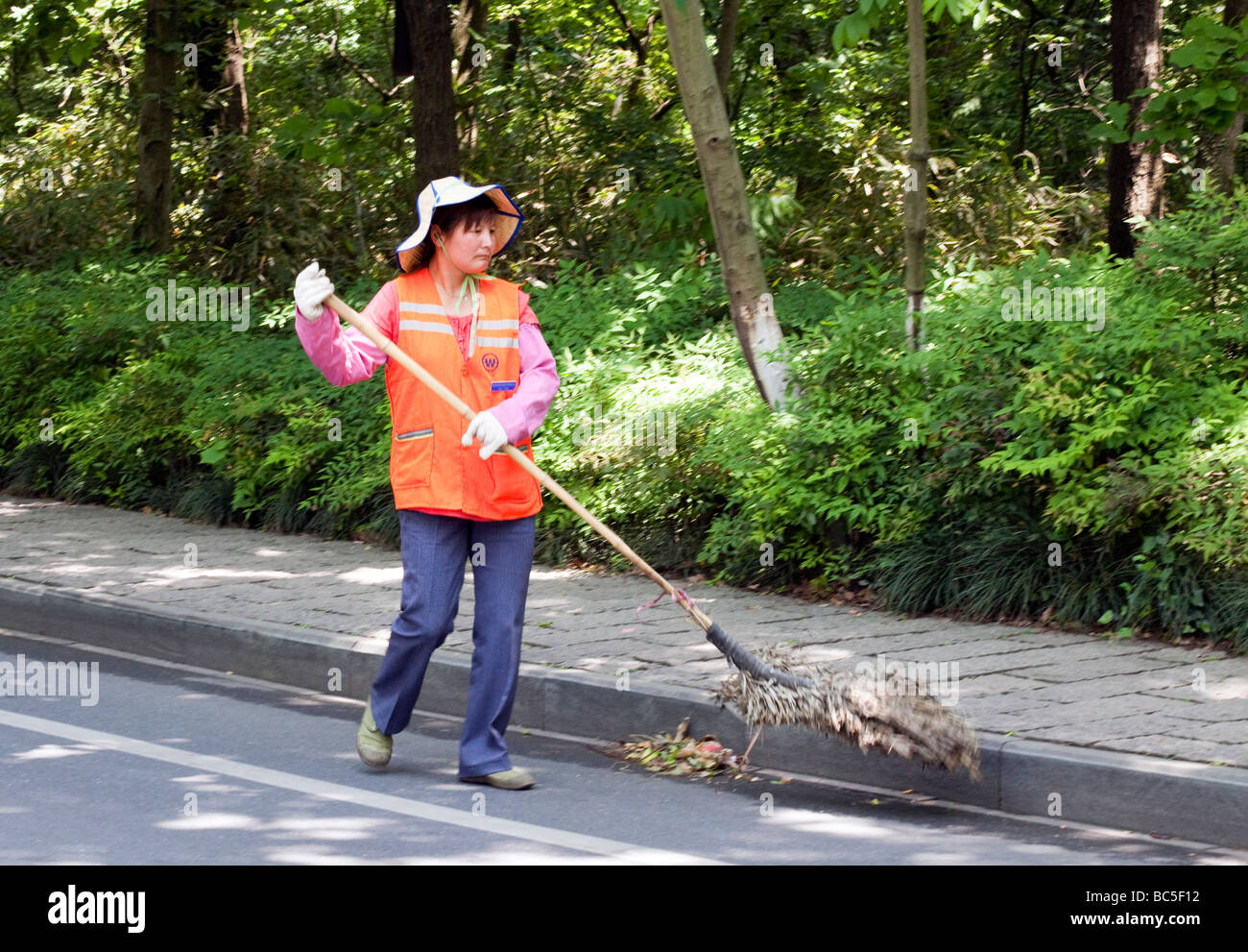 Sweeper lady hi-res stock photography and images - Alamy