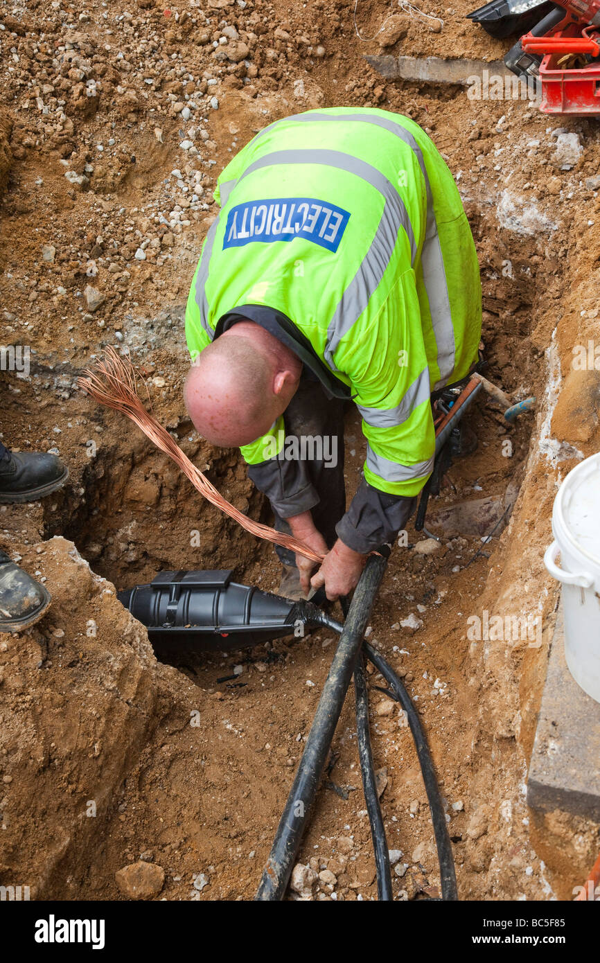 EDF workers repairing an electrical cable in the ground Stock Photo - Alamy