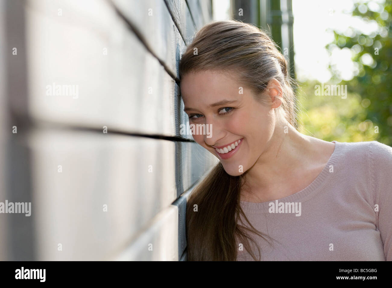 Germany, Bavaria, Munich, young woman smiling, portrait Stock Photo - Alamy