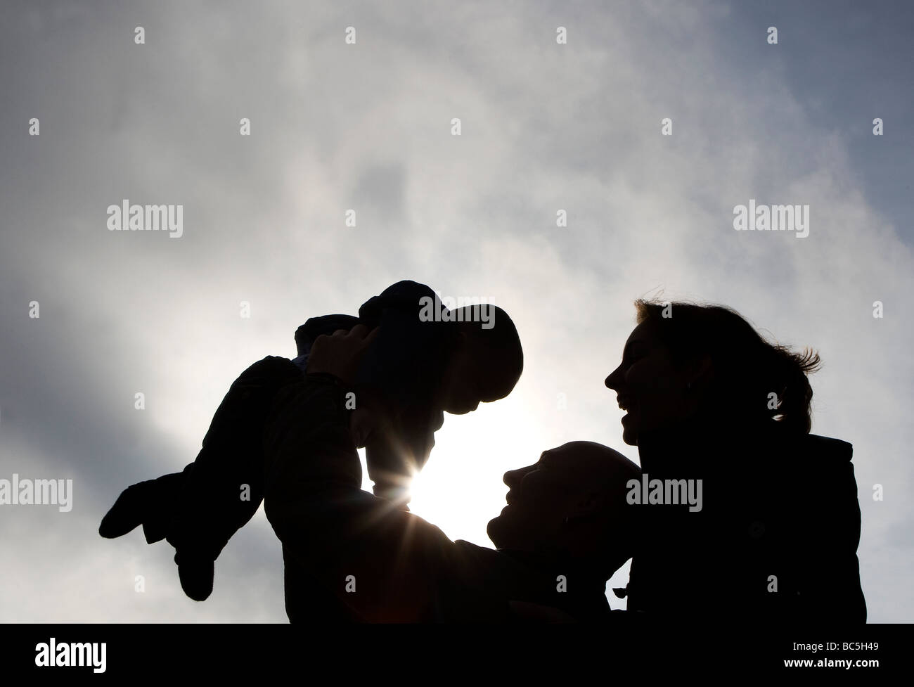 Silhouette of Family, Father lifting child (1-2), close-up Stock Photo ...