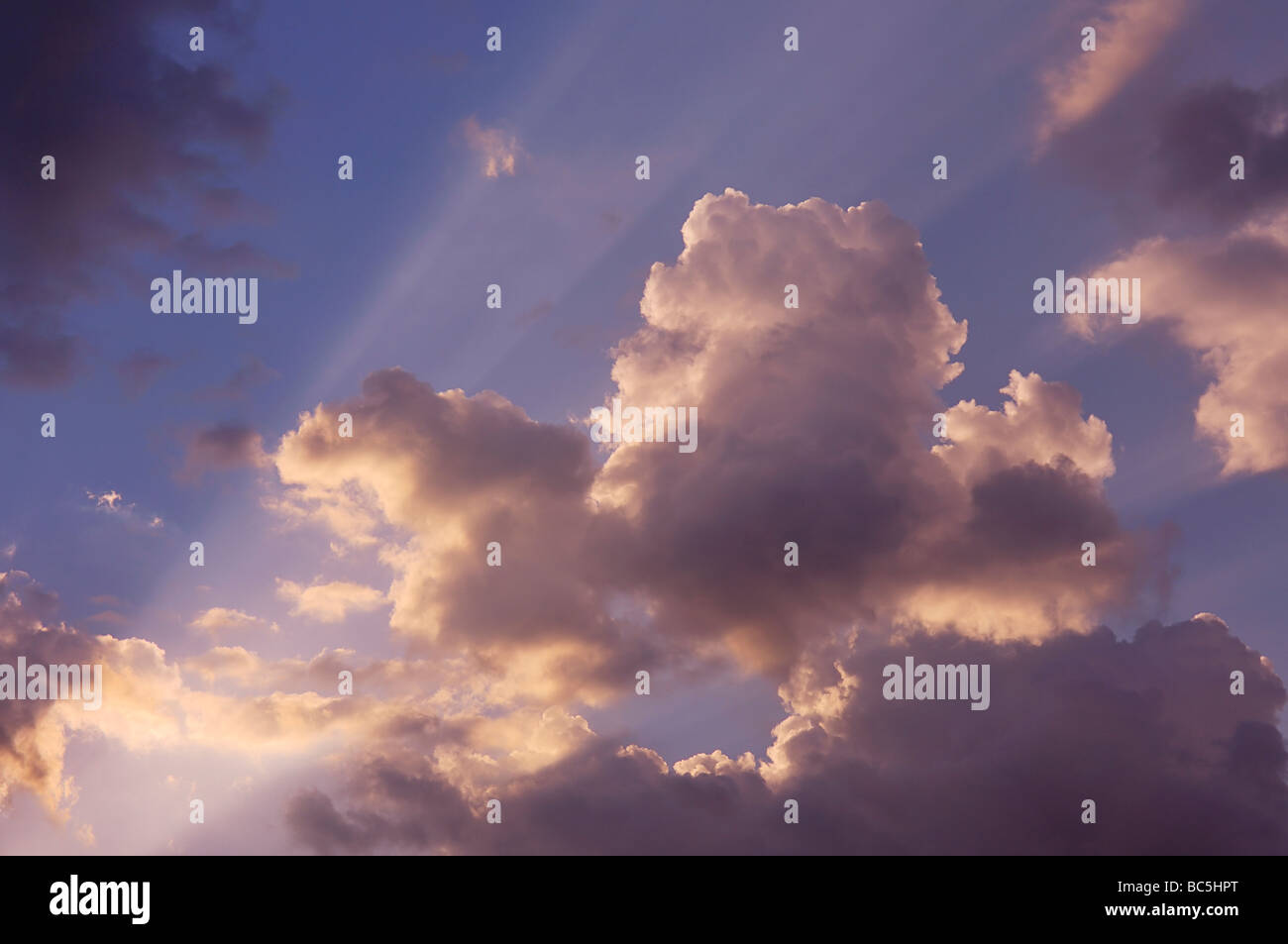 Sun rays shining through clouds, low angle view Stock Photo - Alamy