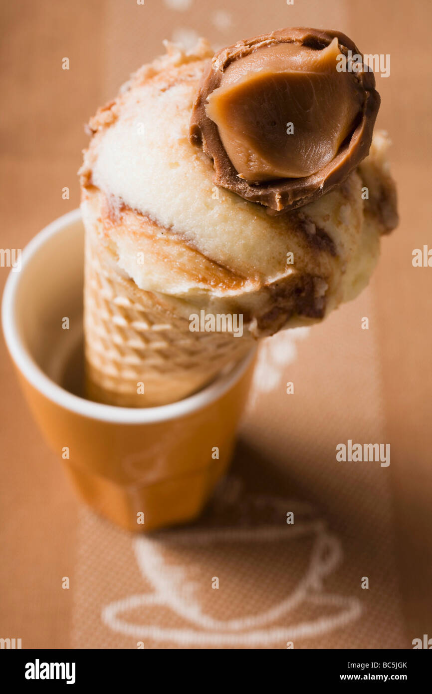 Caramel ice cream in wafer cone in a beaker Stock Photo - Alamy