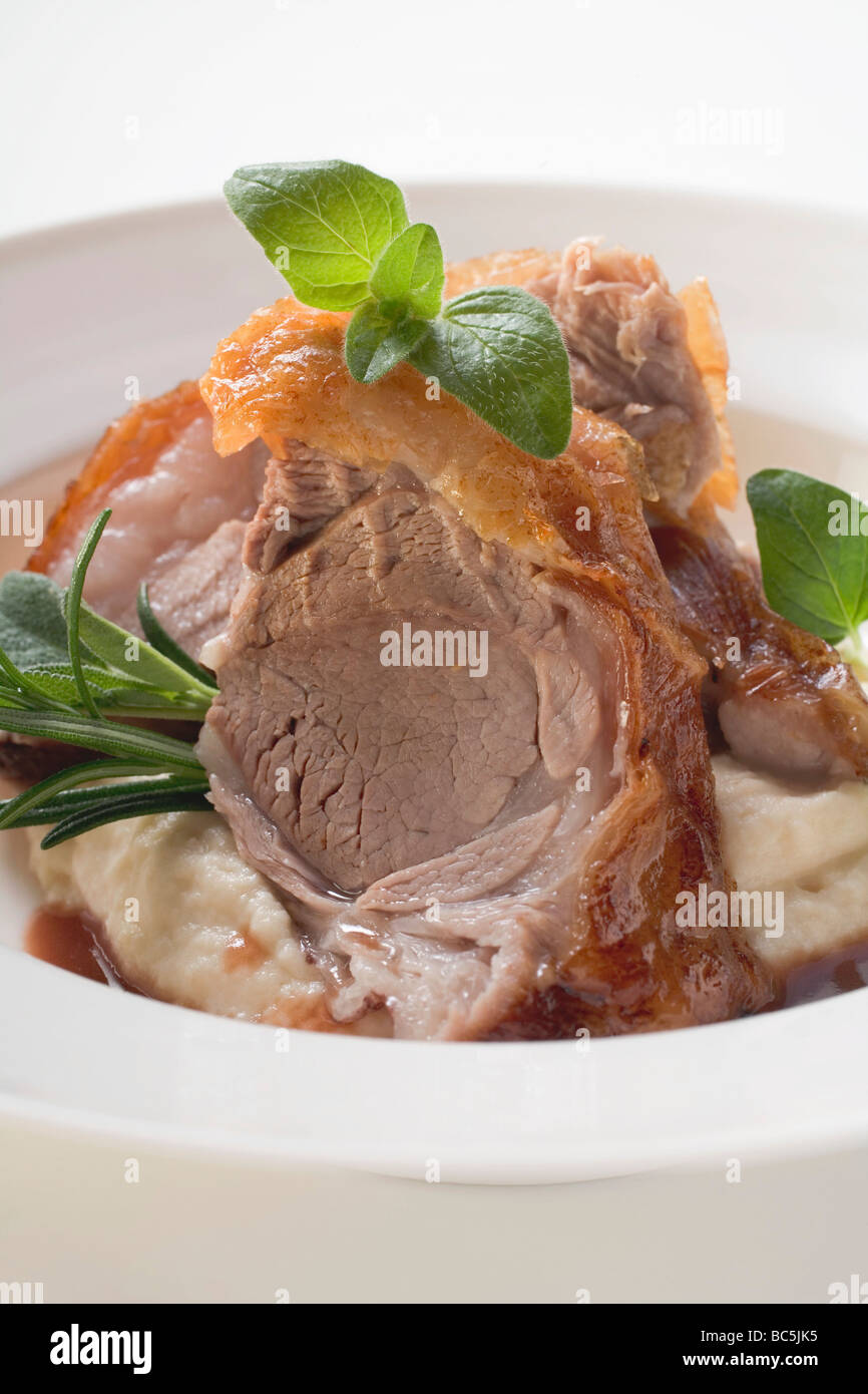 A slice of roast shoulder of lamb with crisp fat Stock Photo - Alamy