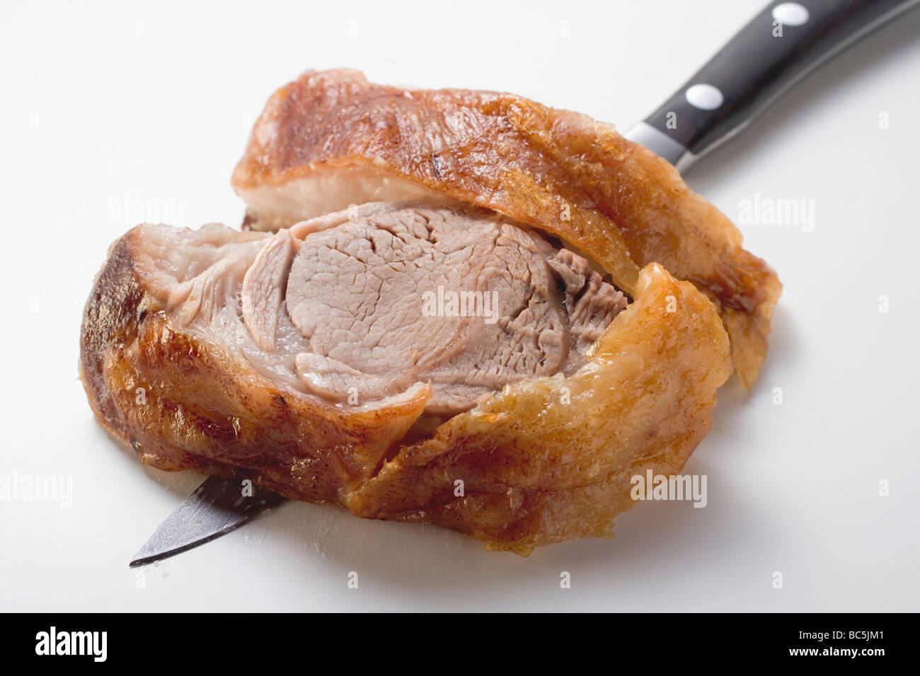 A slice of roast shoulder of lamb with crisp fat Stock Photo - Alamy