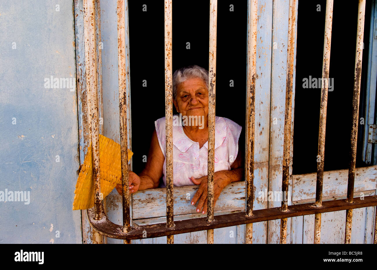 Woman behind bars hi-res stock photography and images - Alamy