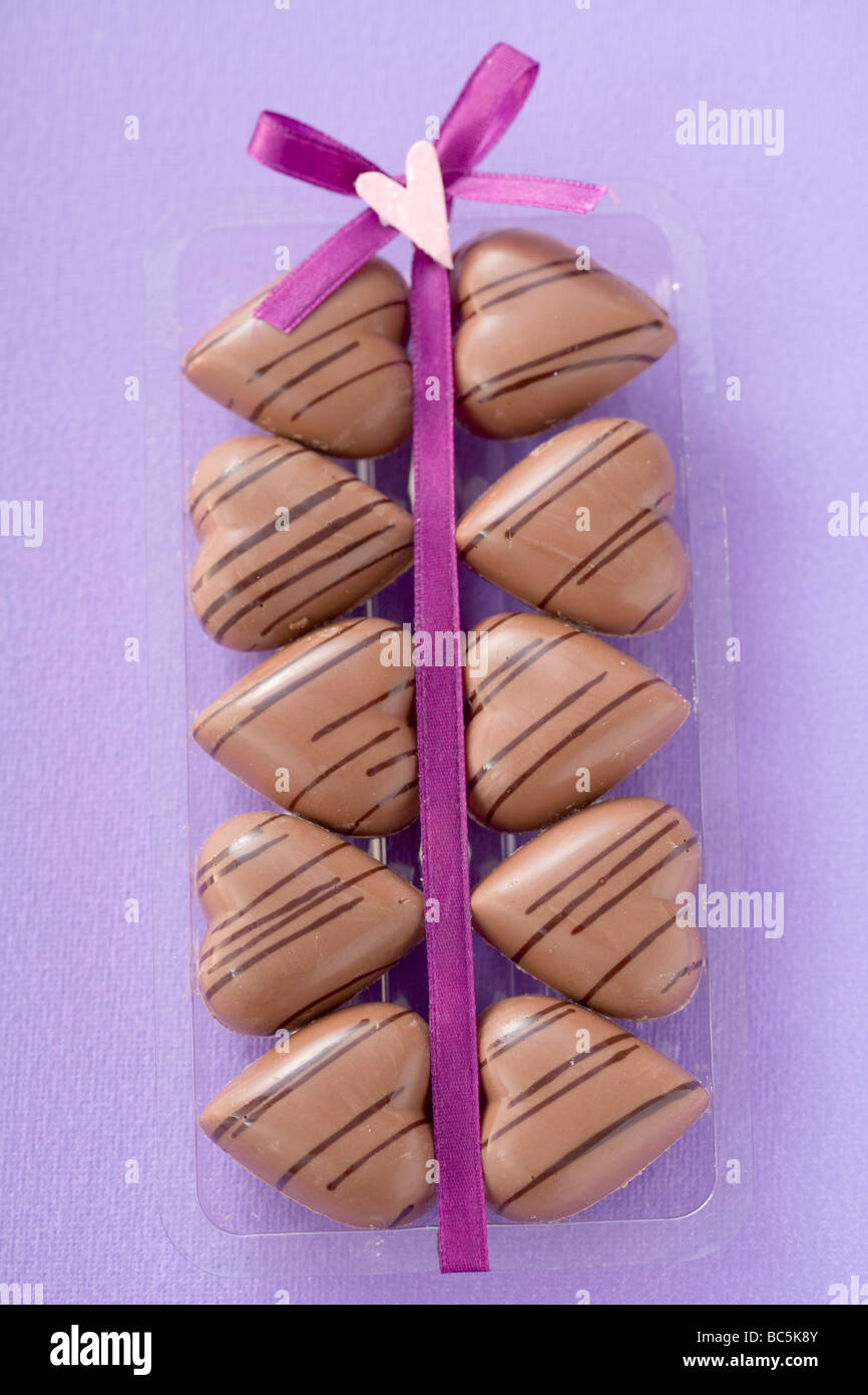 Several heart-shaped chocolates Stock Photo - Alamy