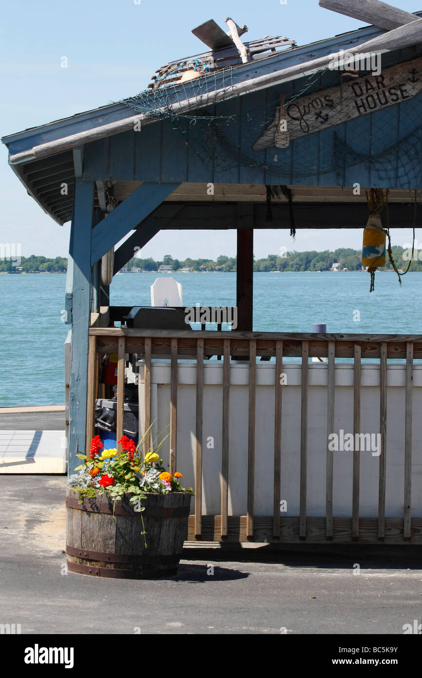 Waterside houseboat on a pier board against blue sky Lake Erie Put in ...