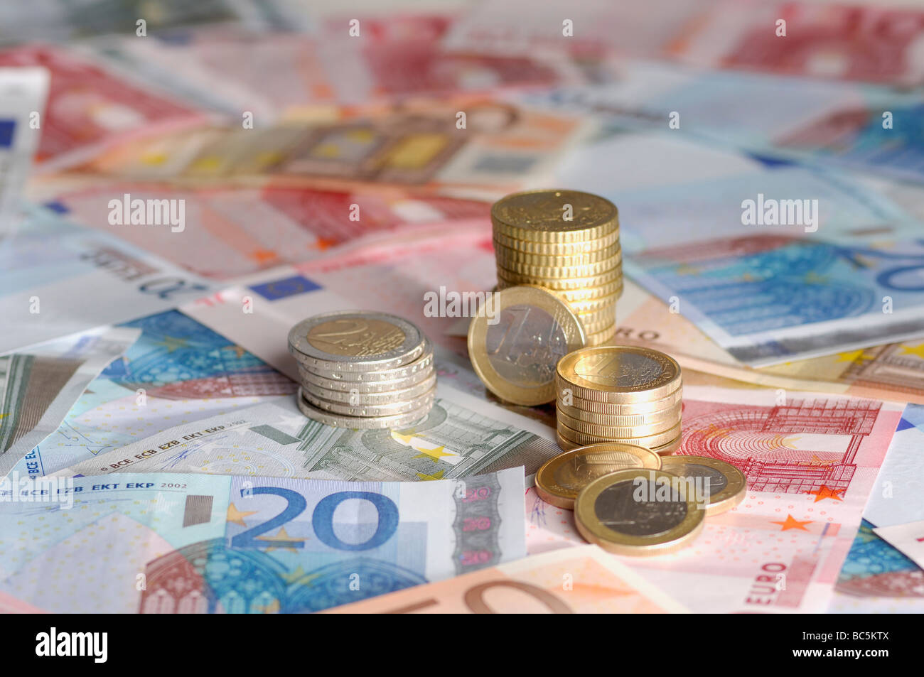 Euro notes and coins, close up Stock Photo - Alamy