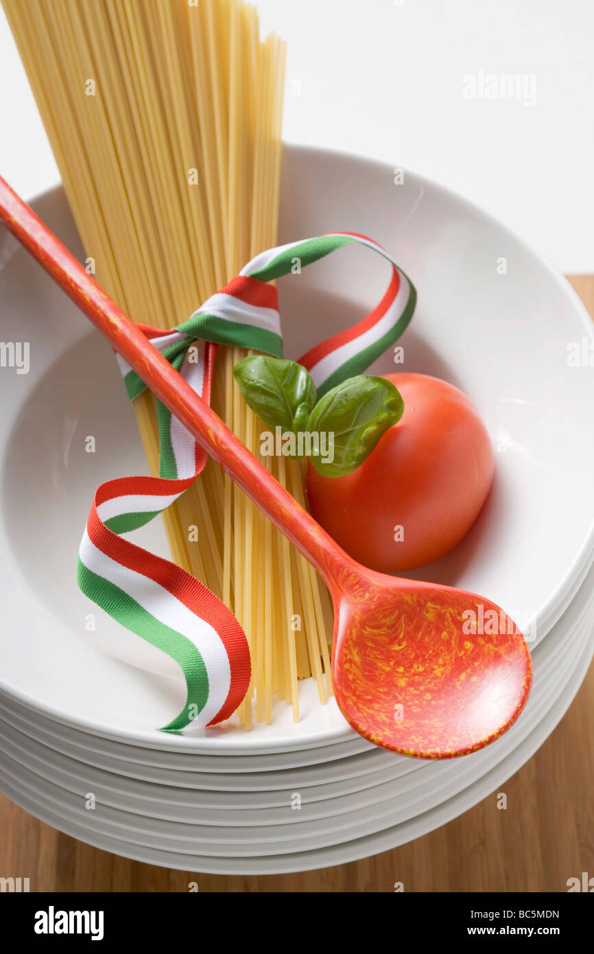 Spaghetti with Italian ribbon, basil and tomato Stock Photo - Alamy