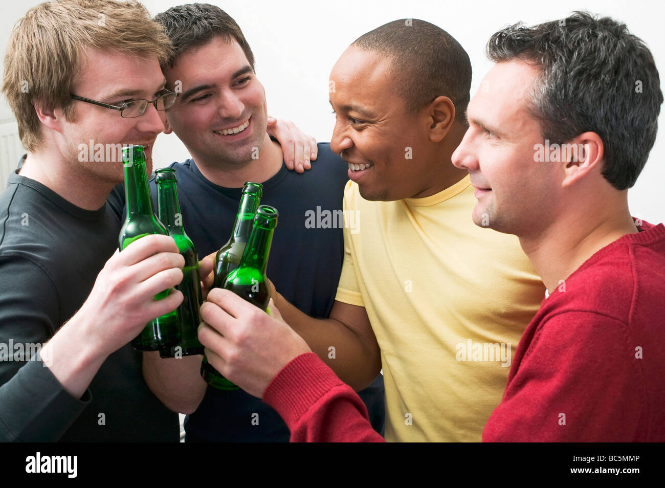 Four men stand hi-res stock photography and images - Alamy