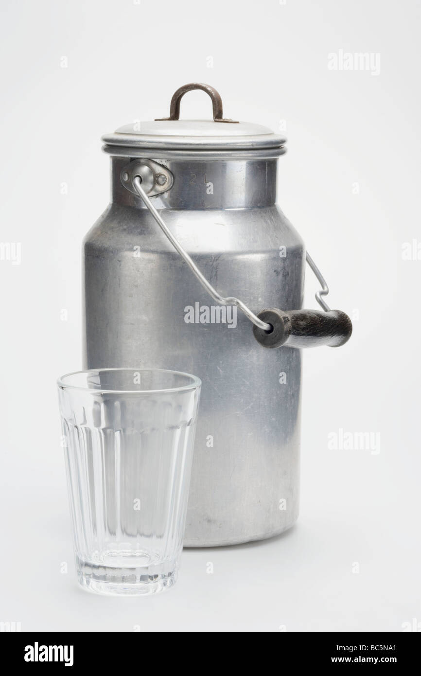 A milk can and an empty glass Stock Photo - Alamy