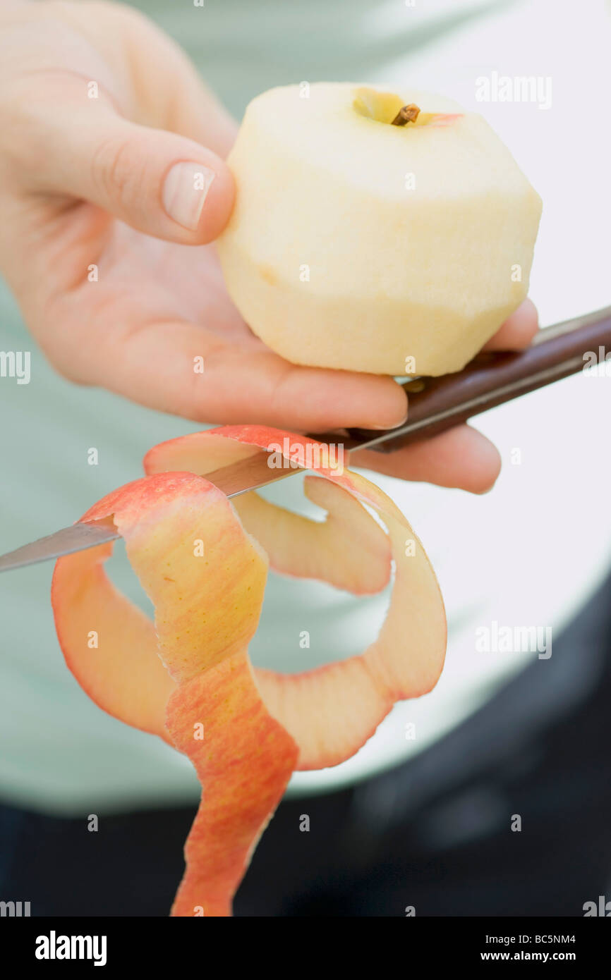 Peeled apple and apple peel Stock Photo - Alamy